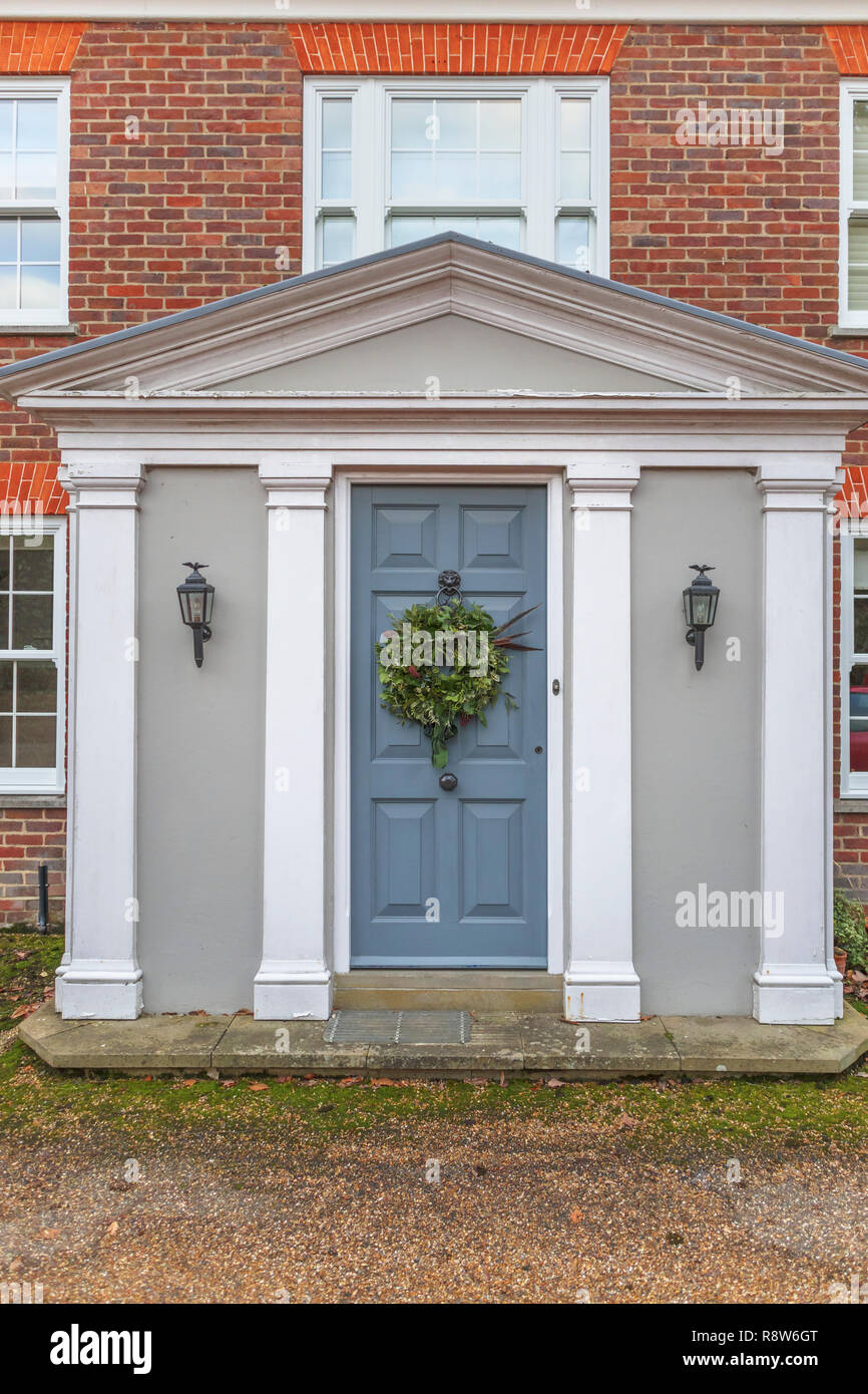 Traditional round Christmas decorative foliage wreath hanging on the ...