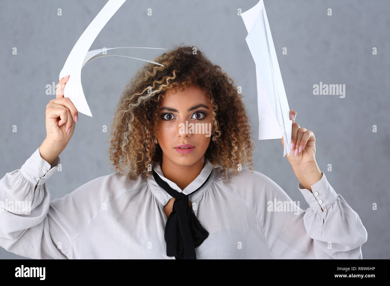 Beautiful black woman portrait. Holds paper documents Stock Photo - Alamy