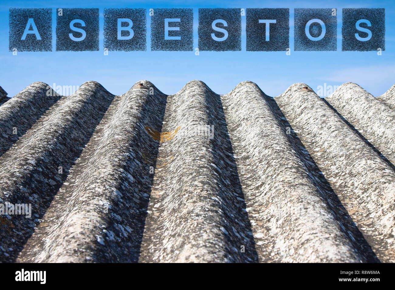 Dangerous asbestos roof. The word asbestos written with letters whose ...