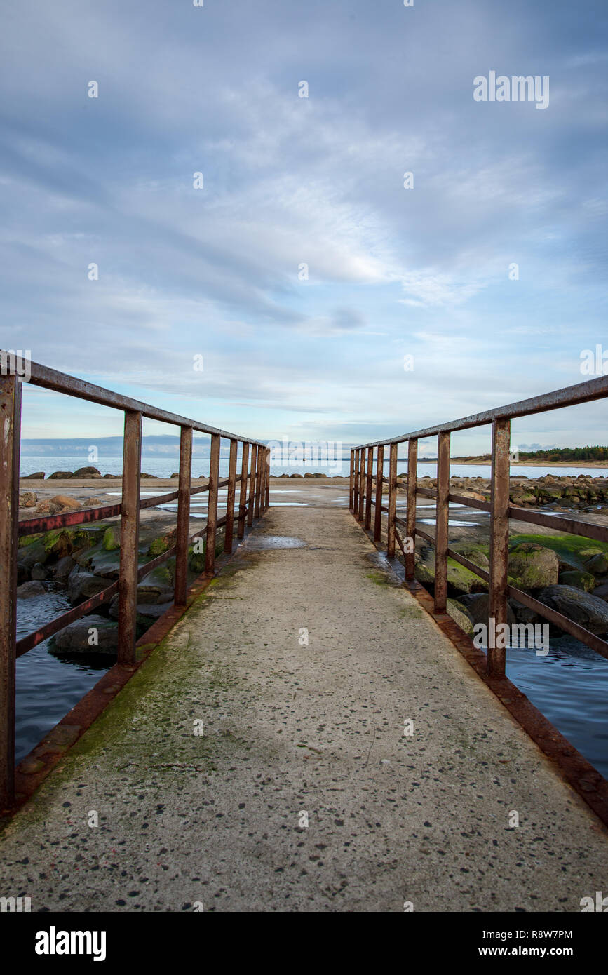 old rusty metal bridge in port. pier in the sea Stock Photo - Alamy