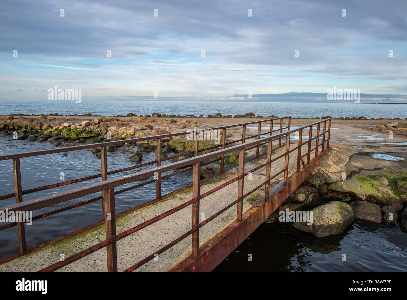 old rusty metal bridge in port. pier in the sea Stock Photo - Alamy