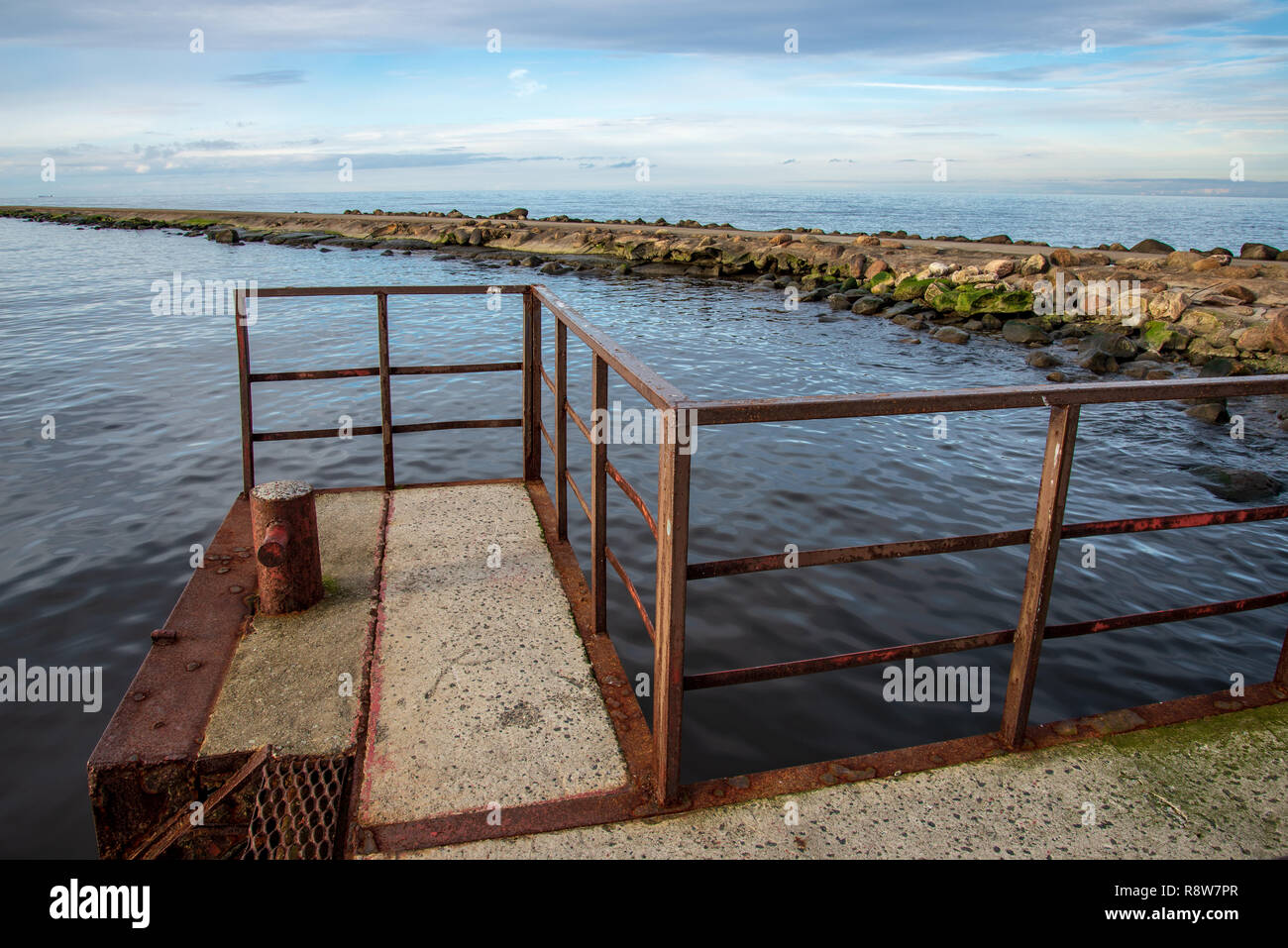 old rusty metal bridge in port. pier in the sea Stock Photo - Alamy