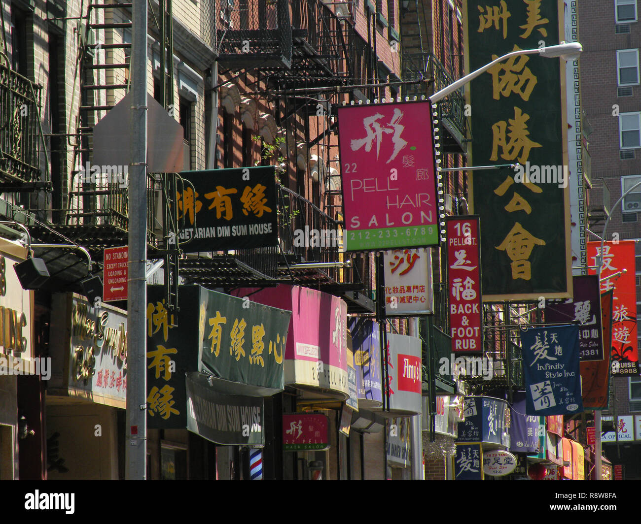 Chinese and English signs on Pell Street in Chinatown, downtown ...