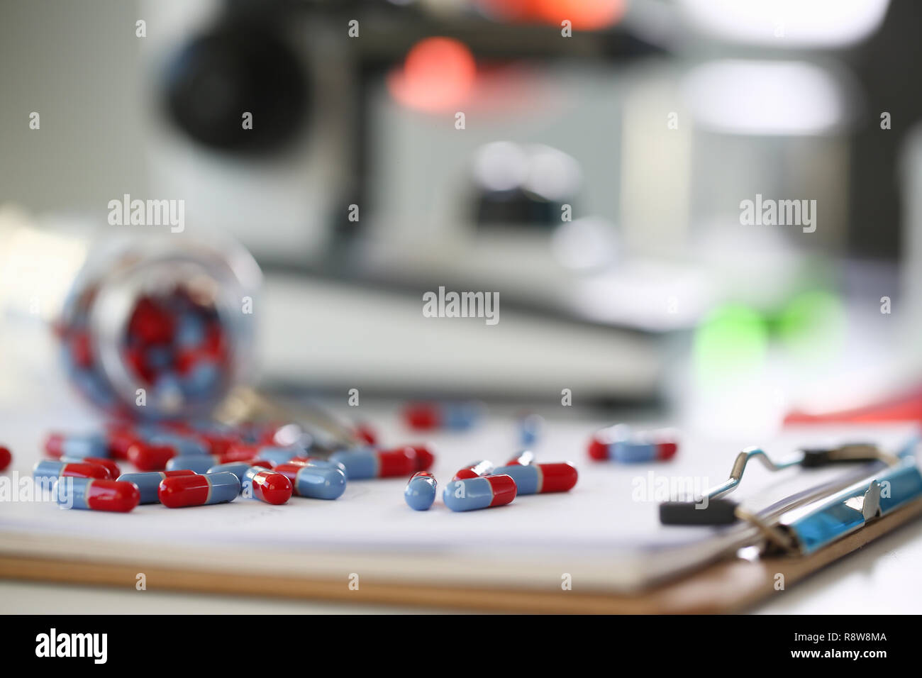 Tablets scattered on the table of the Stock Photo - Alamy