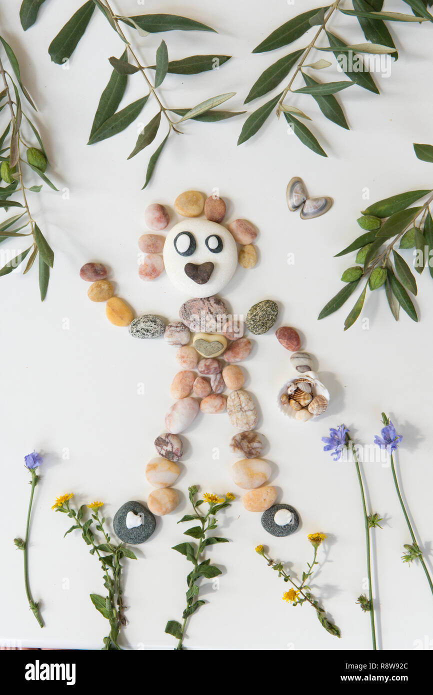 natural art, craft, picture of person surfing, made from pebbles ...