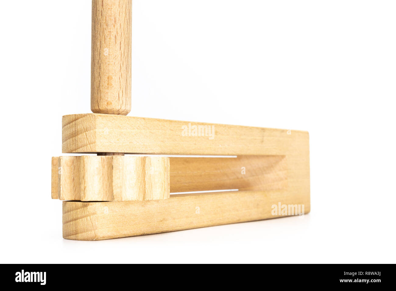 Wooden musical instrument - rattle, studio photo Stock Photo - Alamy