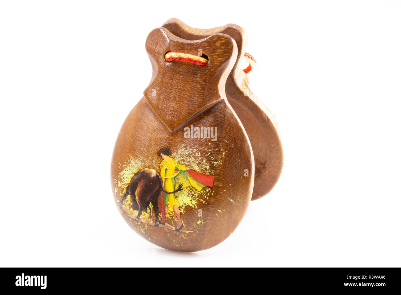 Wooden musical instrument - castanette with image of a bullfighter ...