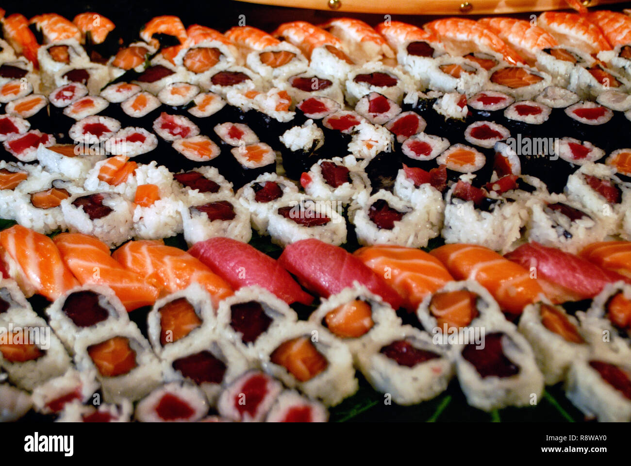 Table full of sushi in japanese style good for health Stock Photo - Alamy