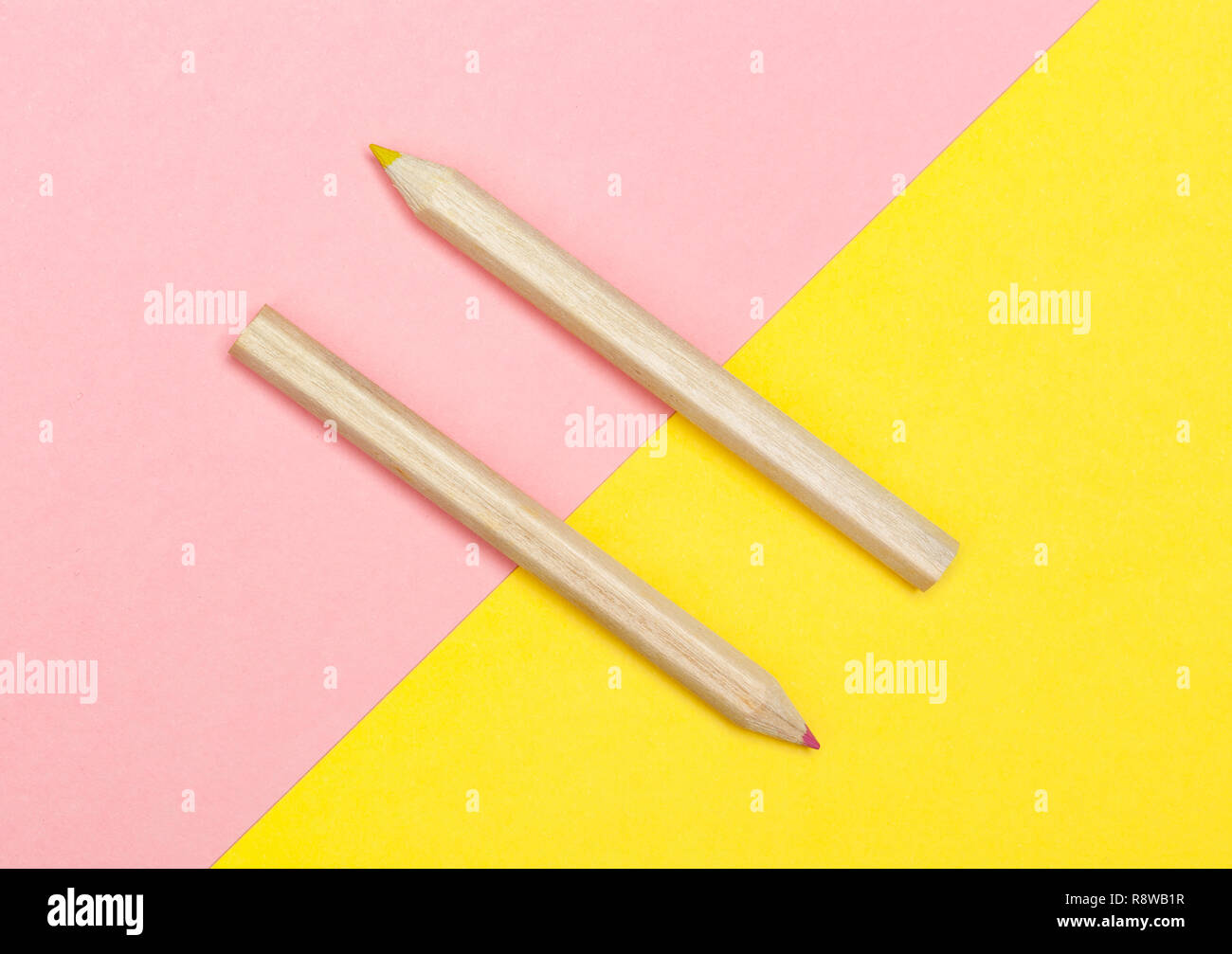 Colored pencils on yellow and pink background. Flat Lay Photography ...