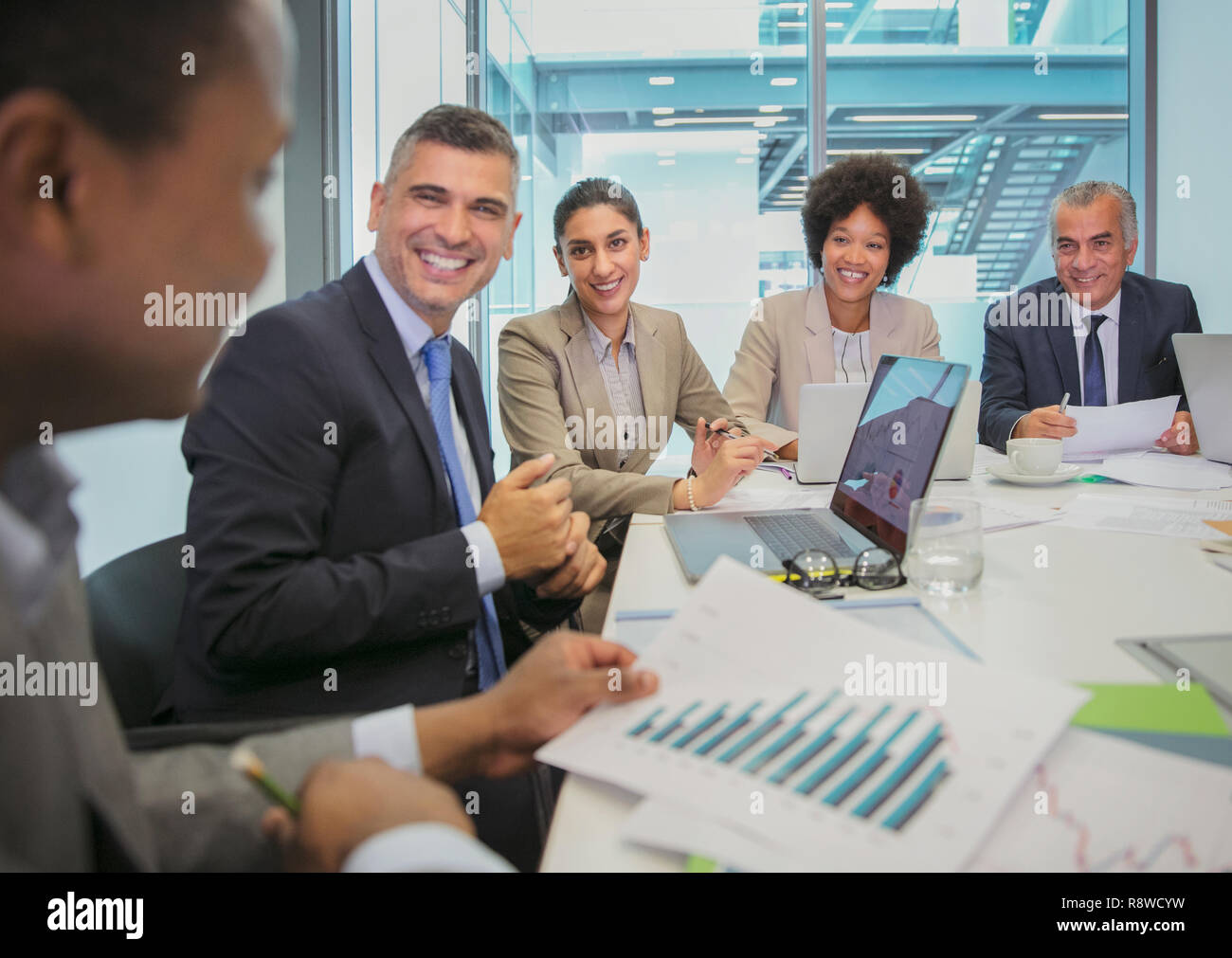 Smiling business people in conference room meeting Stock Photo - Alamy