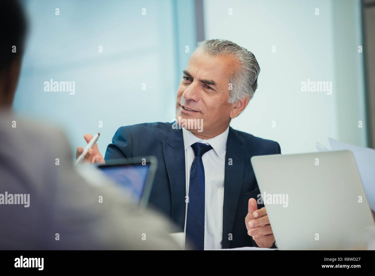 Senior businessman explaining in conference room meeting Stock Photo ...