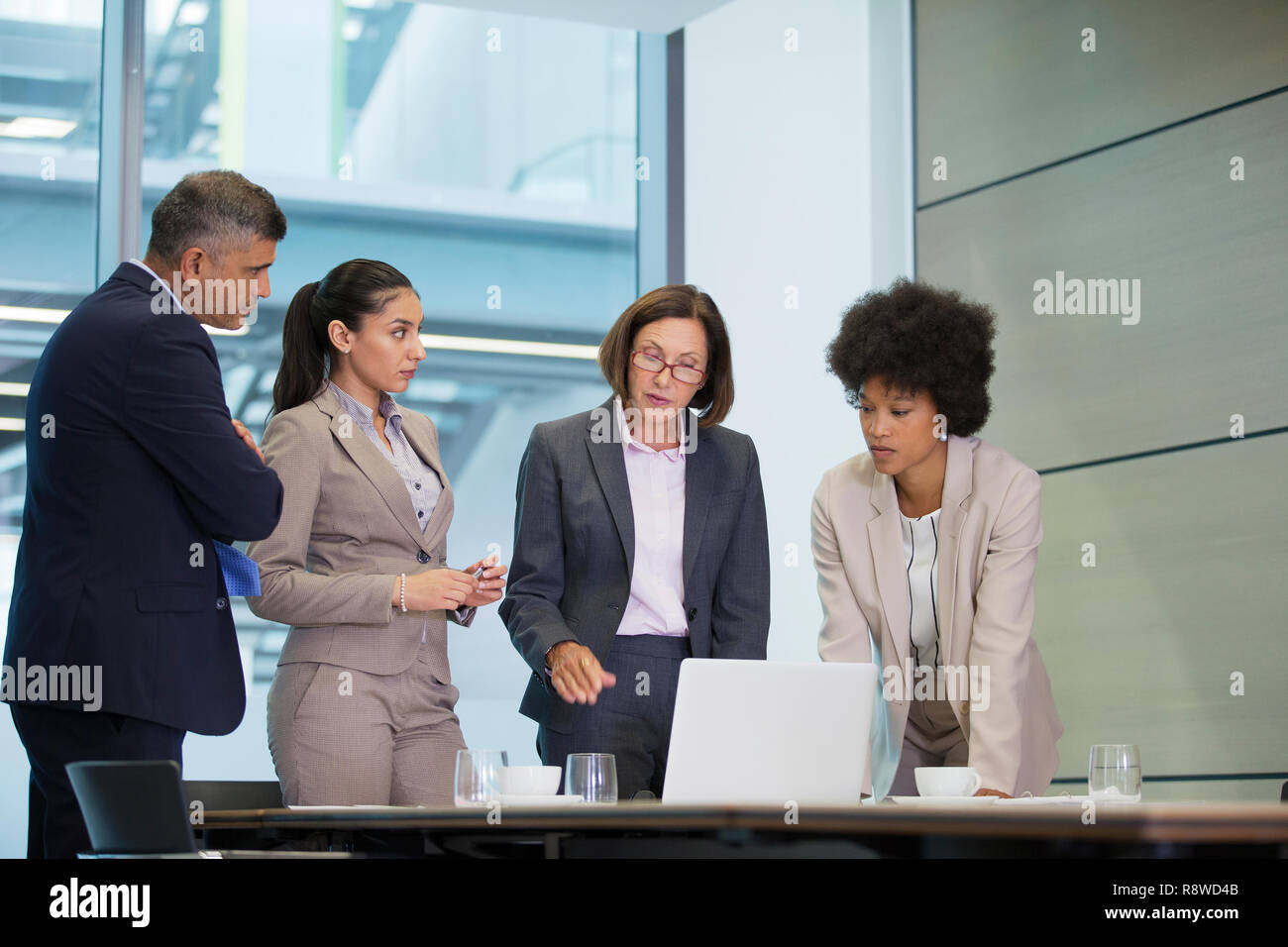 Business people working at laptop in conference room meeting Stock ...
