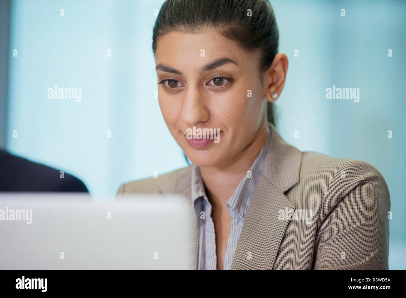 Focused indian woman sitting hi-res stock photography and images - Alamy