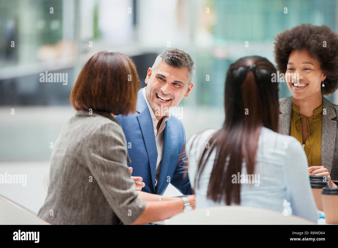 Business people laughing in meeting Stock Photo - Alamy