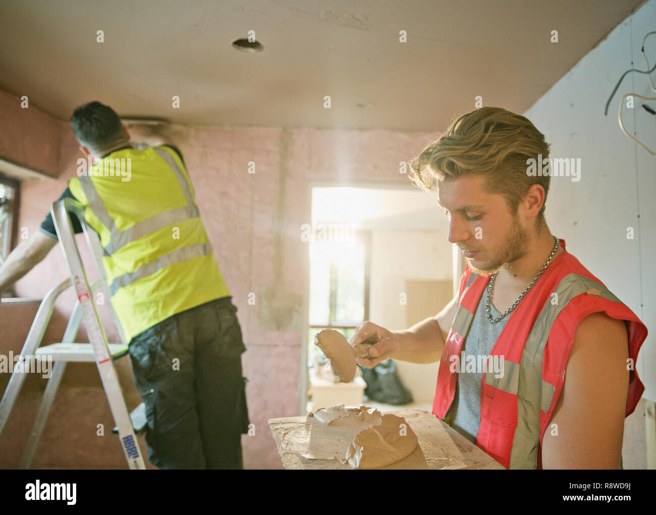 Two construction workers in reflective hi-res stock photography and ...
