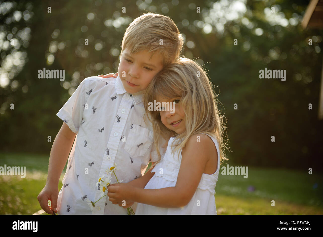 Kids in a field Stock Photo - Alamy
