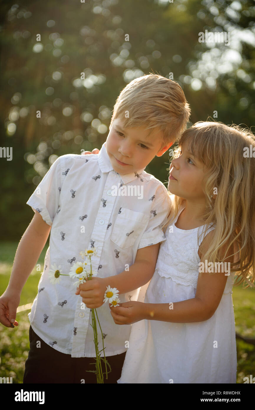 Kids in a field Stock Photo - Alamy