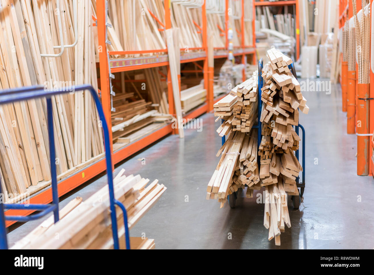 Wood stacked on shelving inside a lumber yard. Lumber Racks Stock Photo ...