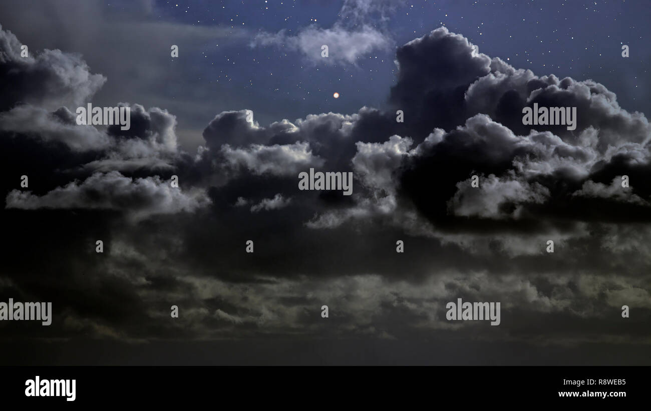 Cloudy night sky with stars Stock Photo - Alamy