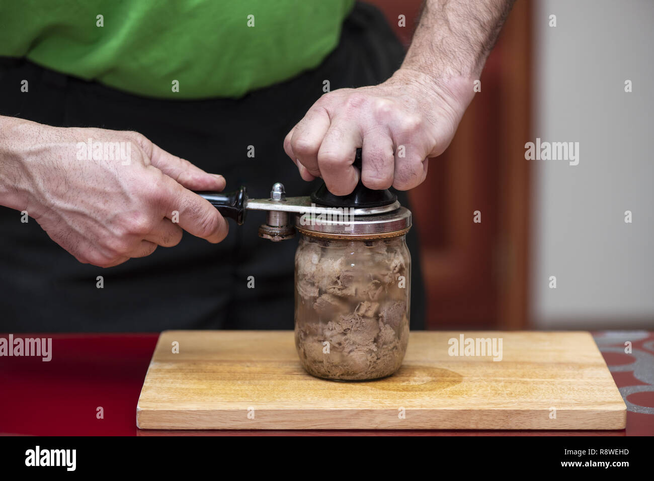 Preparation of homemade pork stew, machine for canning food, process ...