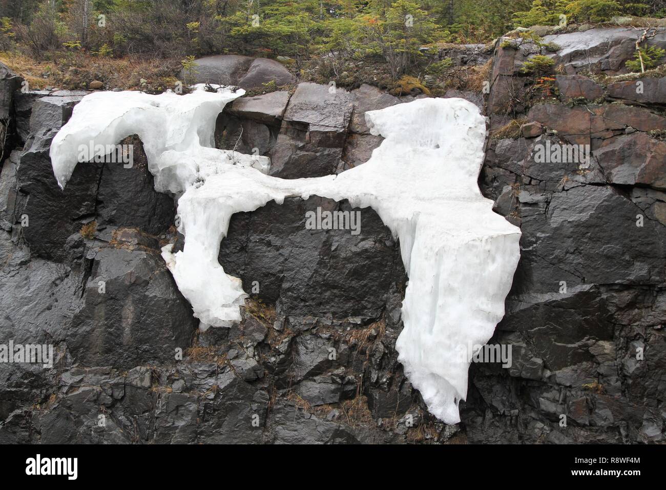 Patches of snow thawing on rocks Stock Photo - Alamy