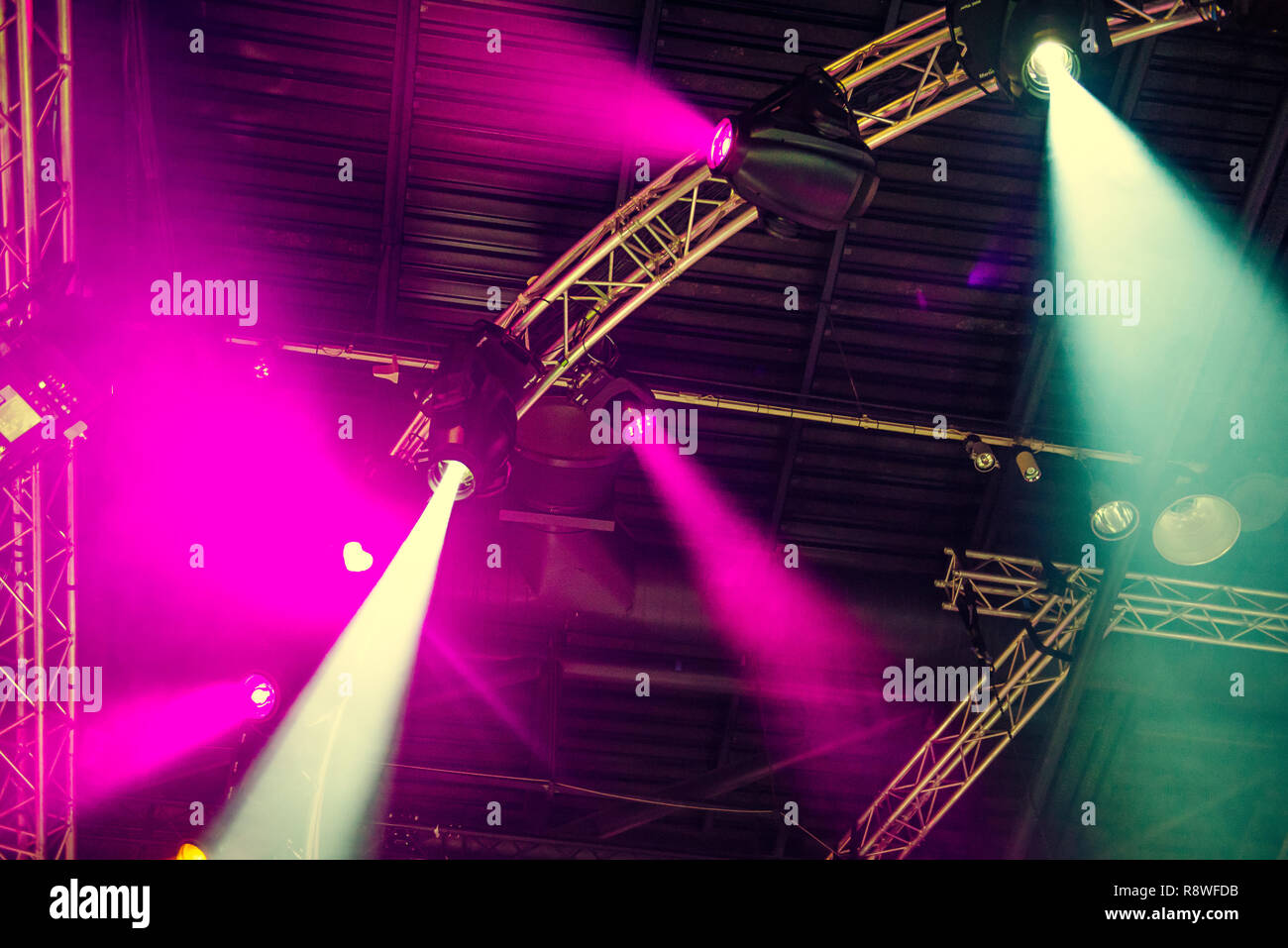Stage lights on concert. Lighting equipment with multi-colored beams ...