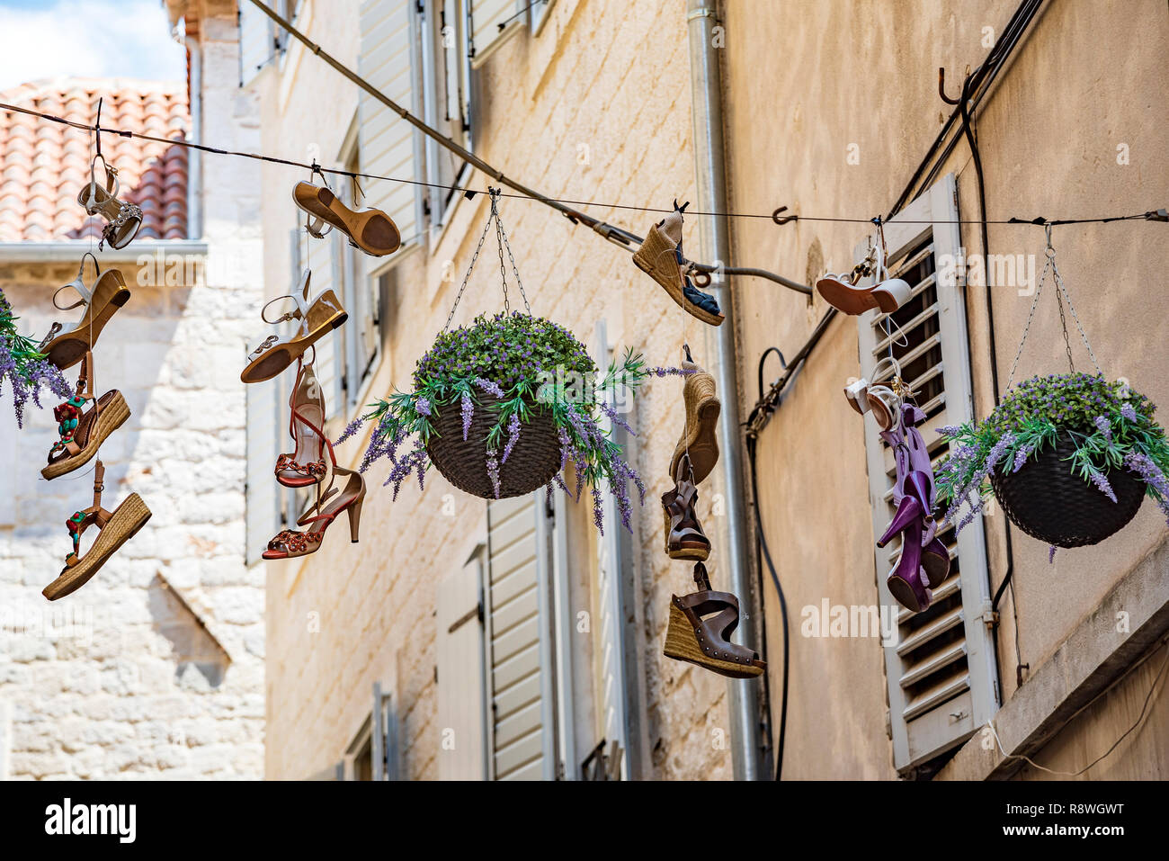 Shoes hanging on power line hi-res stock photography and images - Alamy
