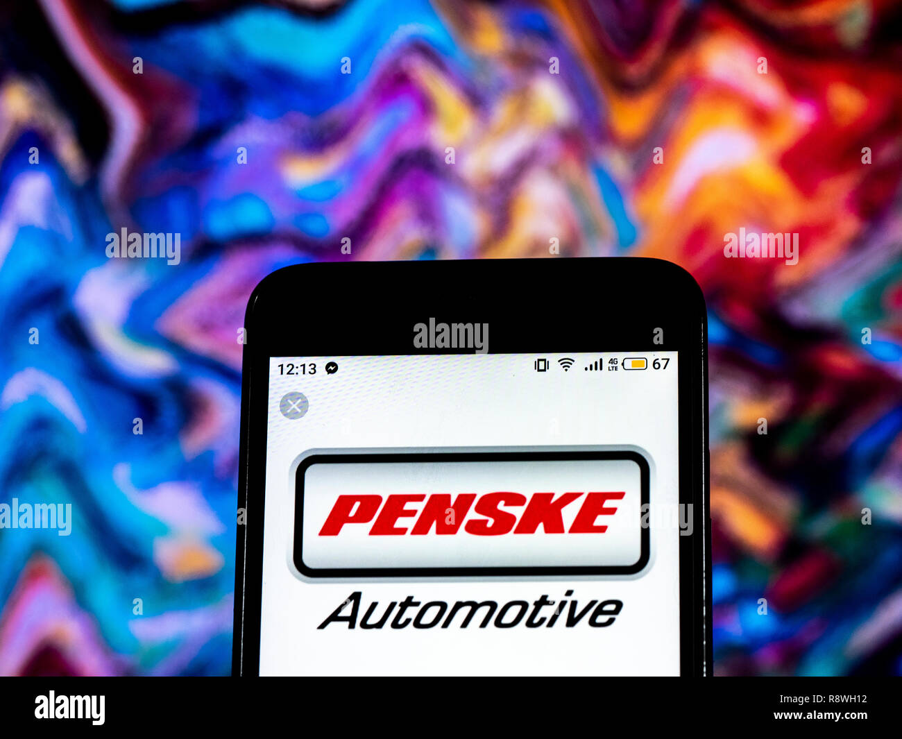 Penske Truck Leasing Company logo seen displayed on smart phone Stock ...