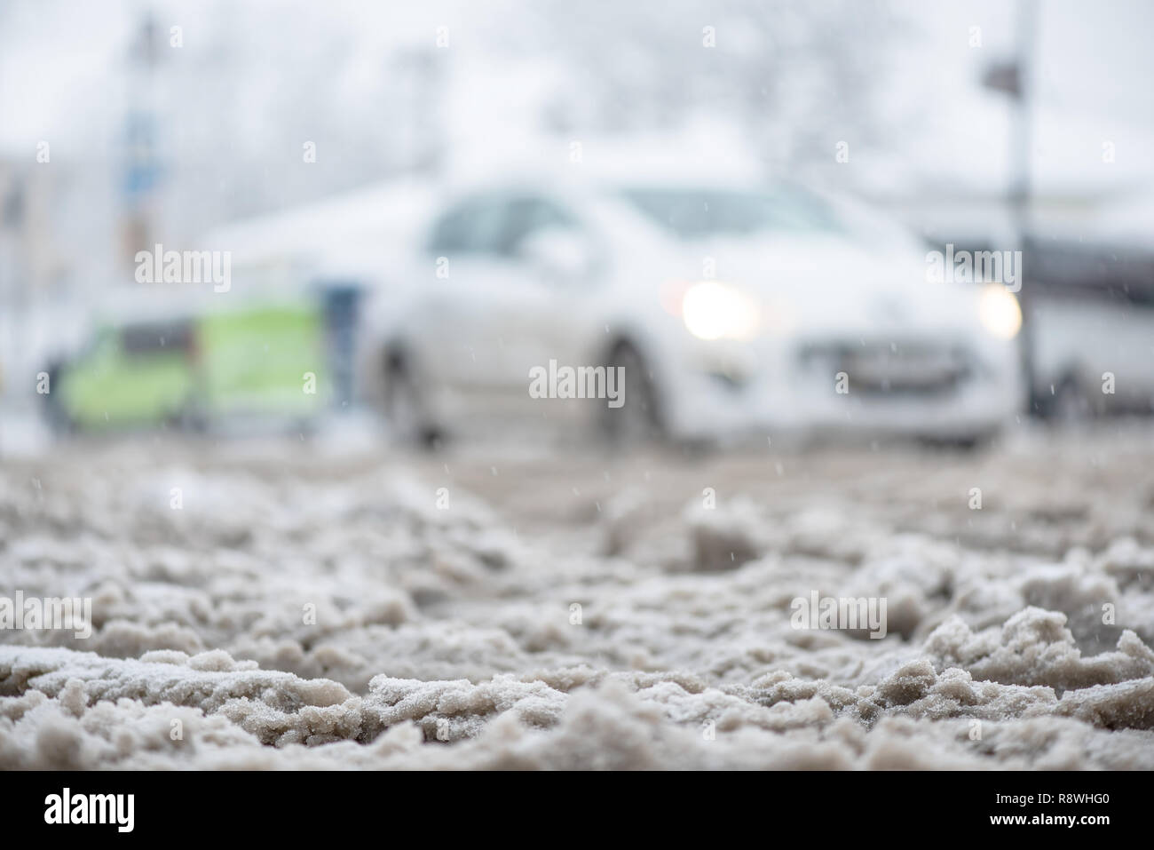 Snow slush on road, thaw, warming. Soft background with copy space for ...