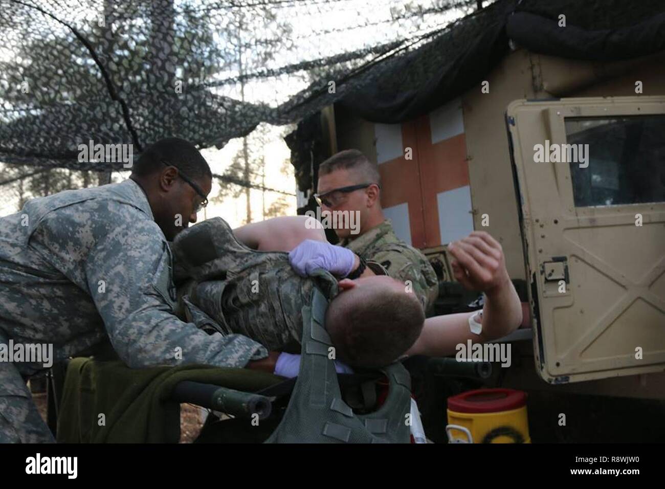 Medics from 2nd Battalion, 4th Infantry Regiment, remove a Soldiers ...