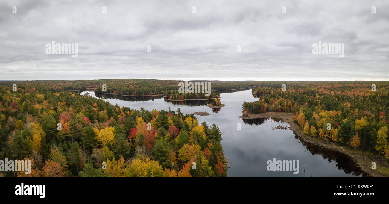 Aerial panoramir view of a beautiful lake in the forest with colorful ...