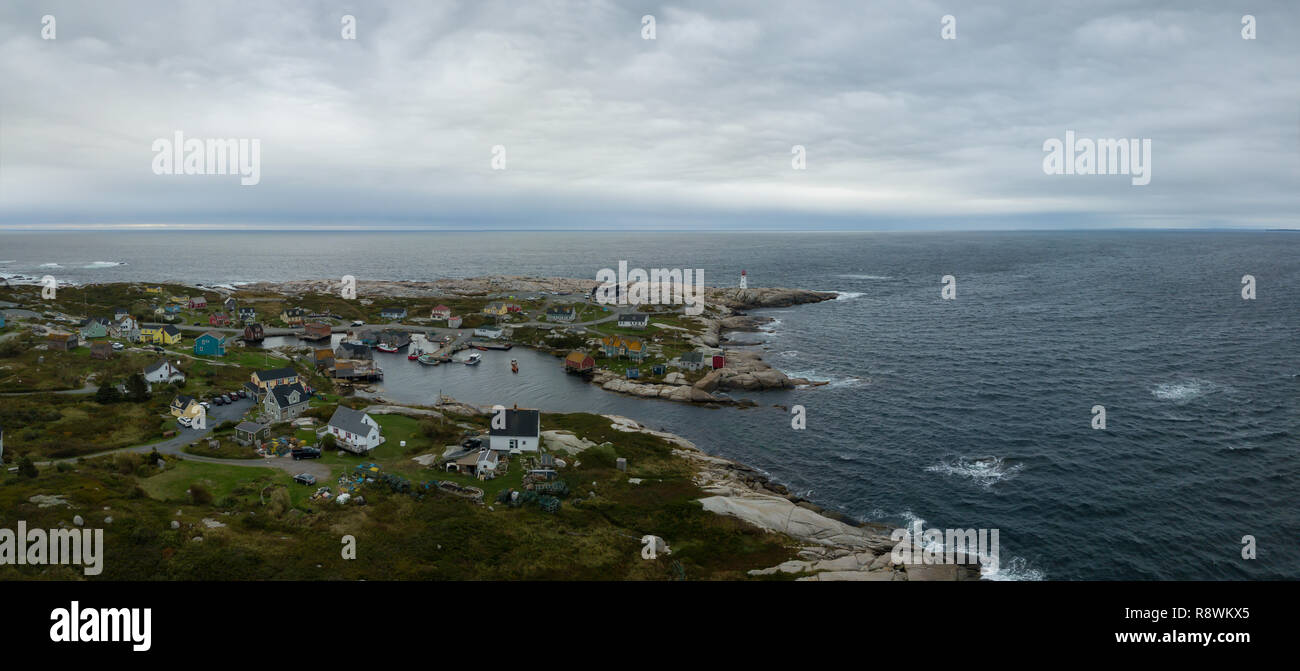 Aerial panoramic view of a small town near a rocky coast on the ...