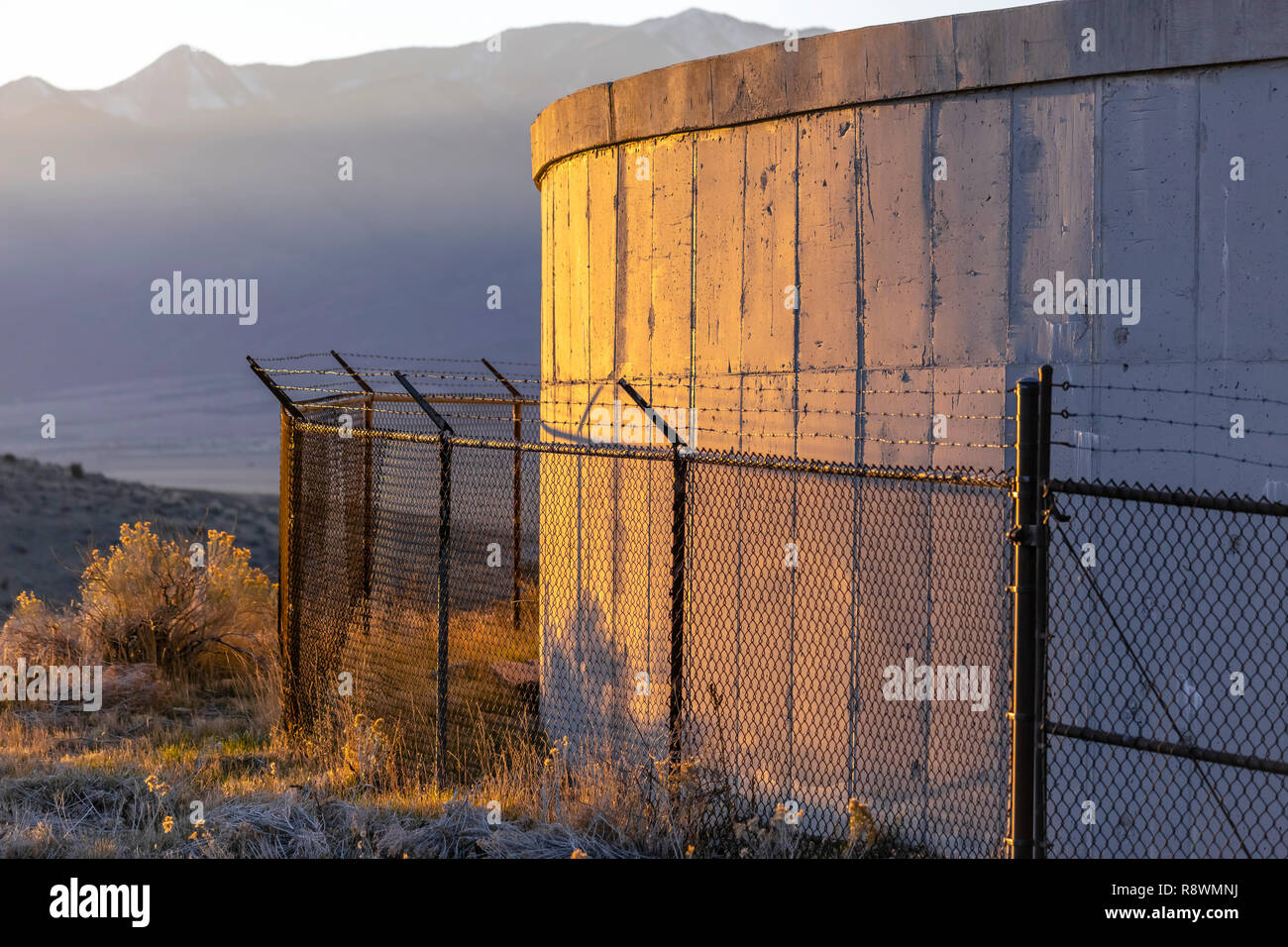 Gold light and cold shadows on concrete water tank Stock Photo - Alamy
