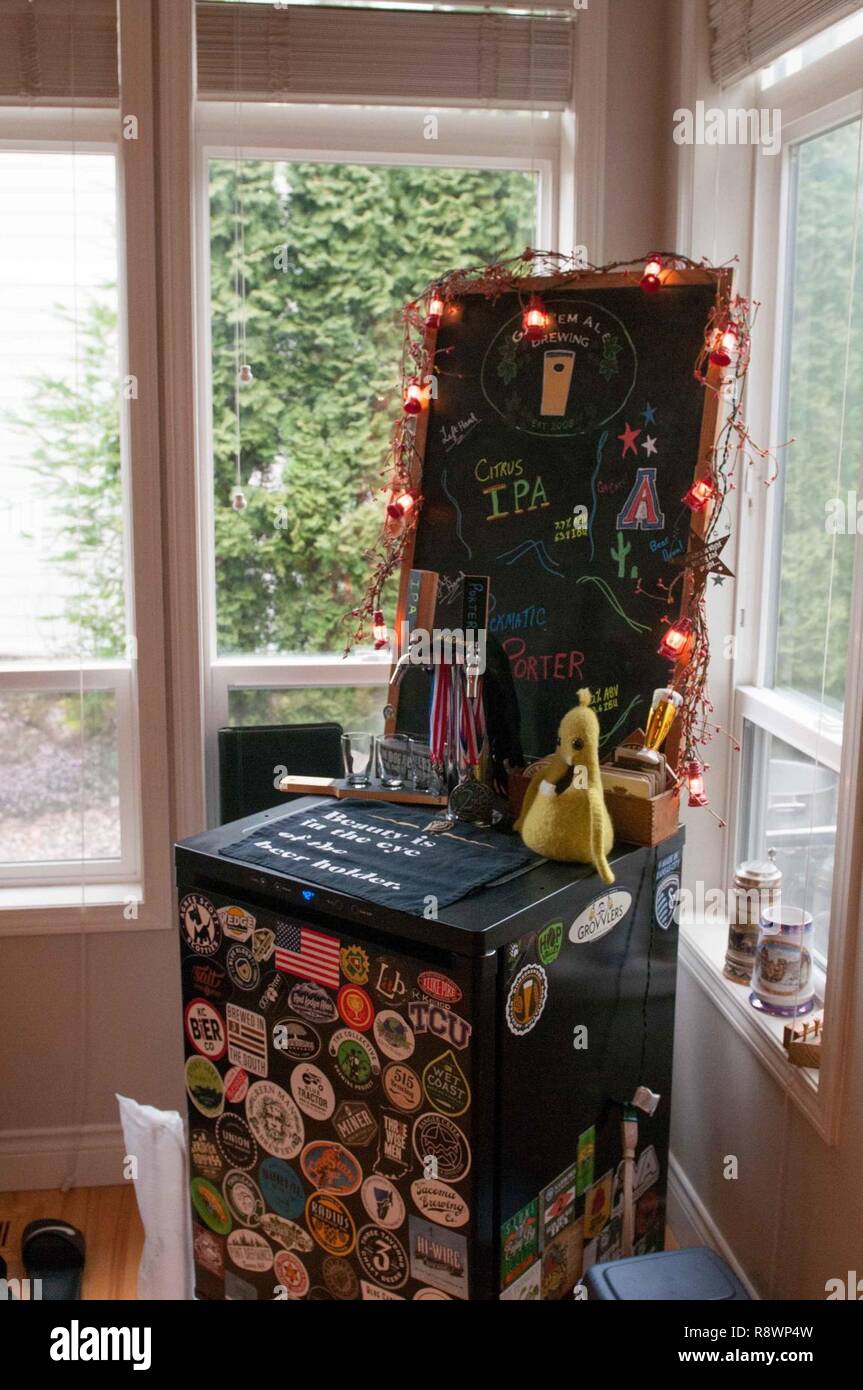 Winning medals are displayed on a kegarator at the home of Col. John ...