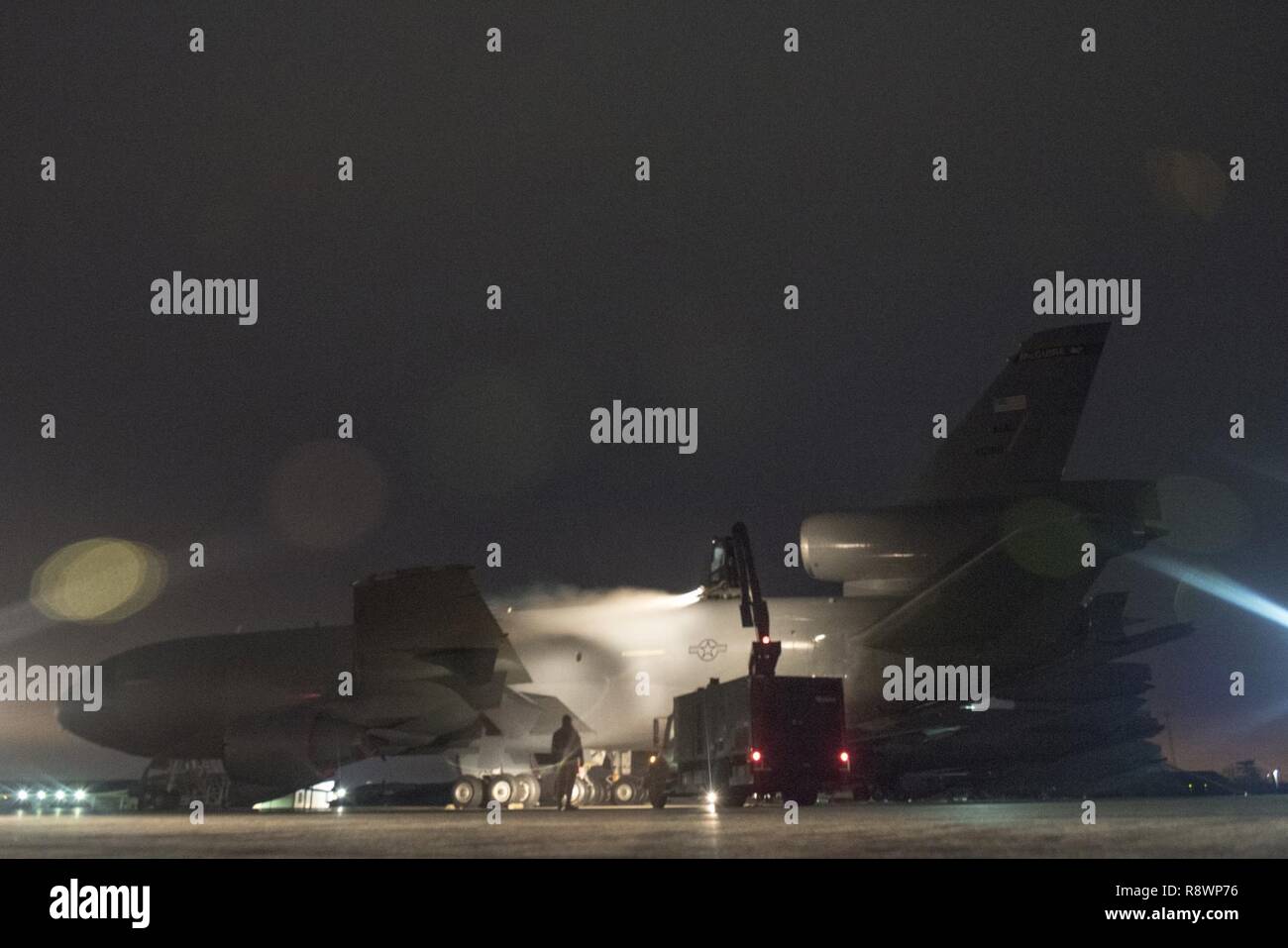 Airmen from the 605th Aircraft Maintenance Squadron deice a KC-10 ...