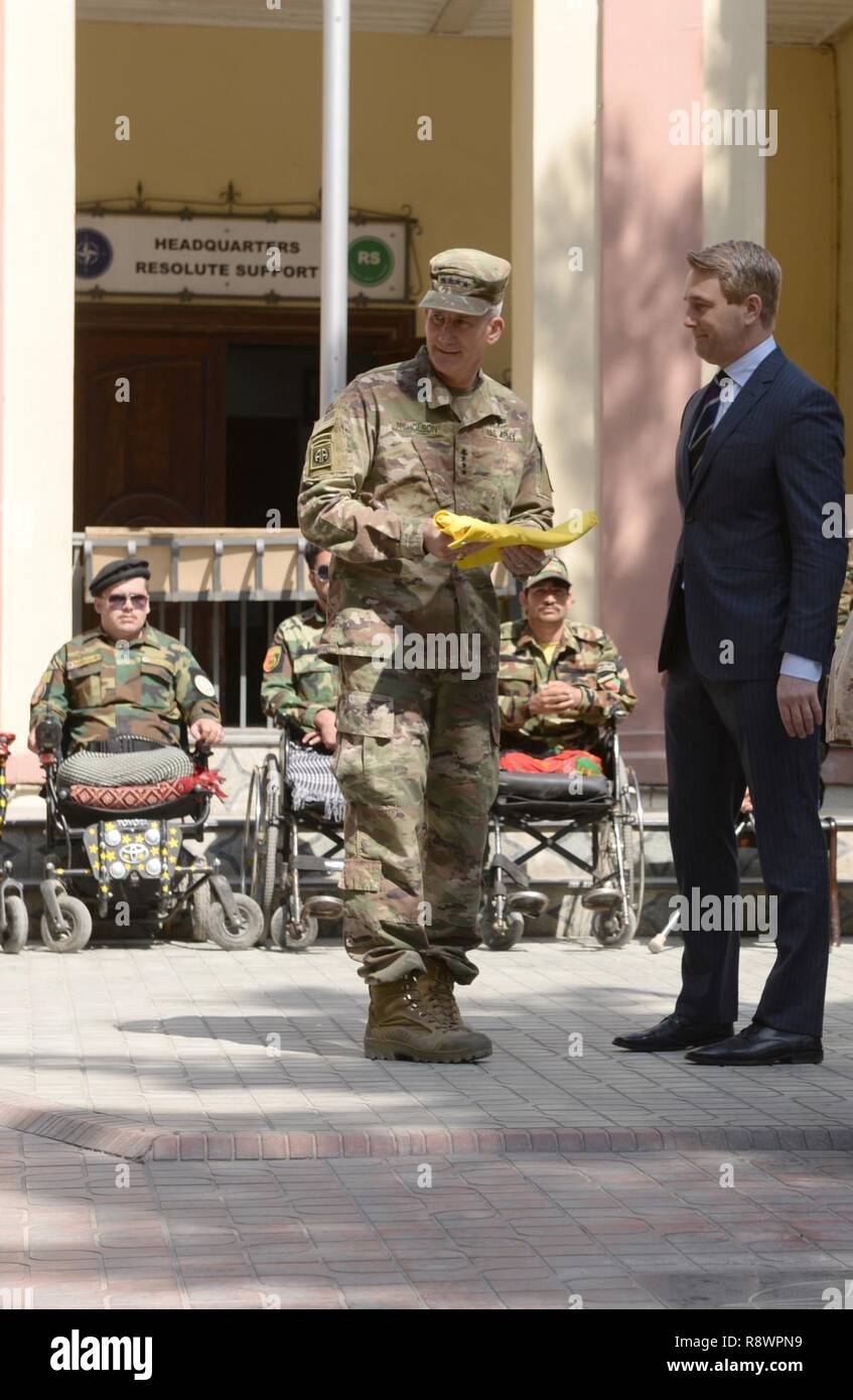 Gen. John Nicholson, holds an Invictus Games flag, during a flag ...