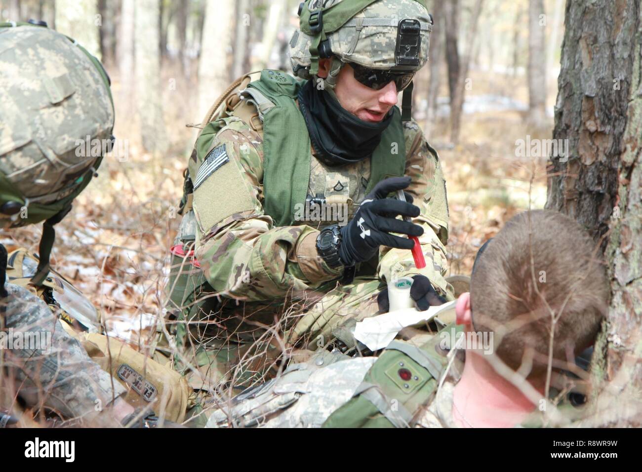 U.S. Army Medic Private First Class Luke Albro treats Specialist Jacob ...