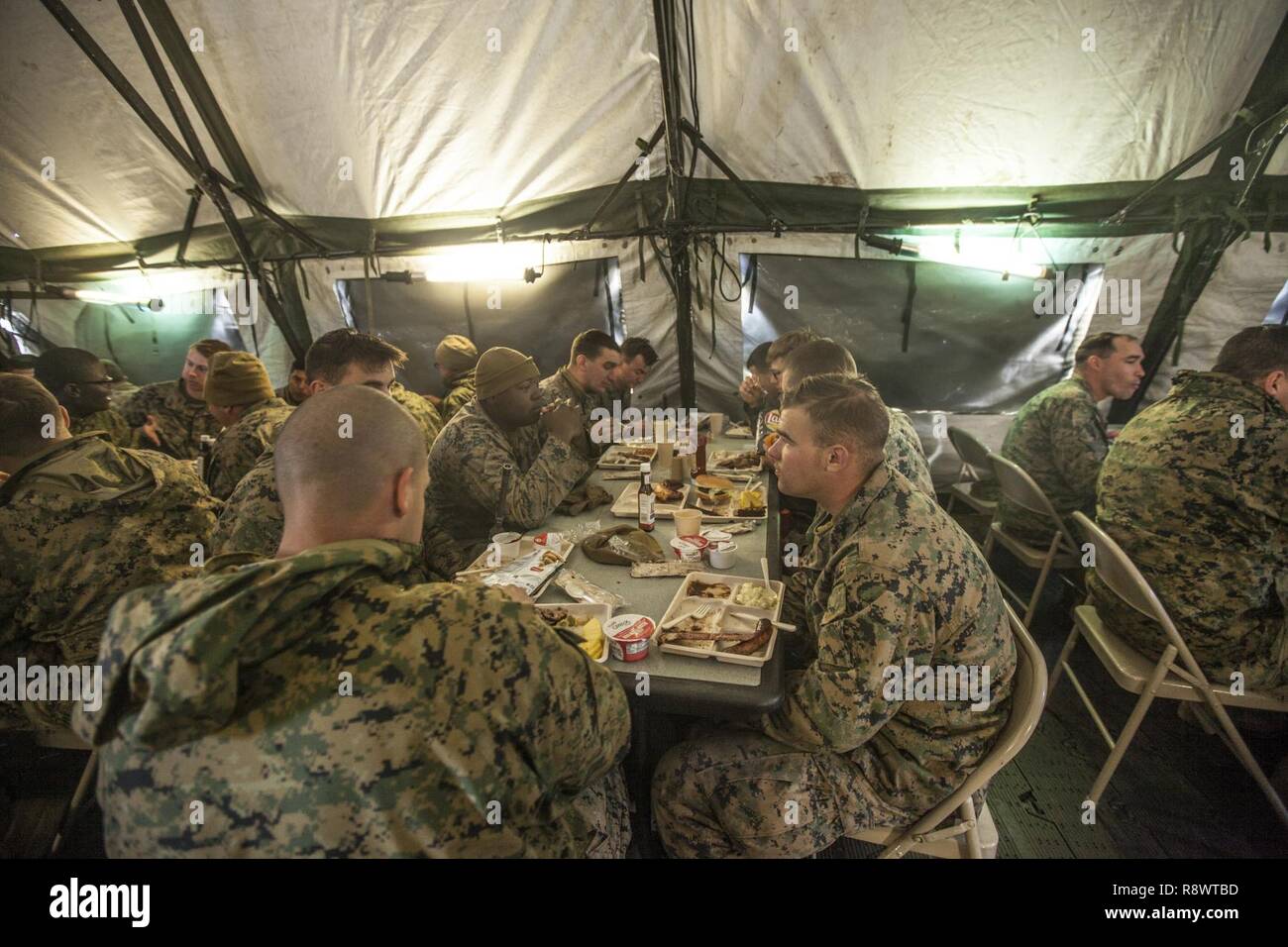 U.S. Marines assigned to Marine Wing Support Squadron (MWSS) 274 eat a ...