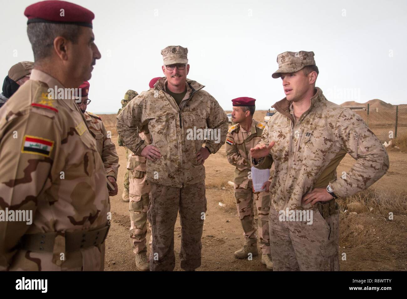U.S. Marine Corps Col. Christian Cabaniss, center, commander, Task Force Al-Taqaddum, and Cpt ...