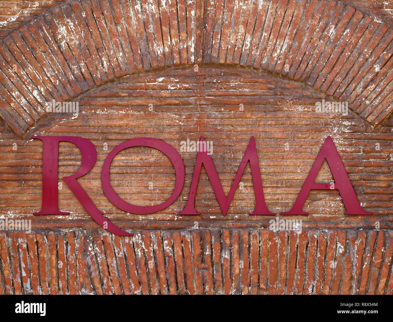 Roma Text on bricks wall Stock Photo - Alamy