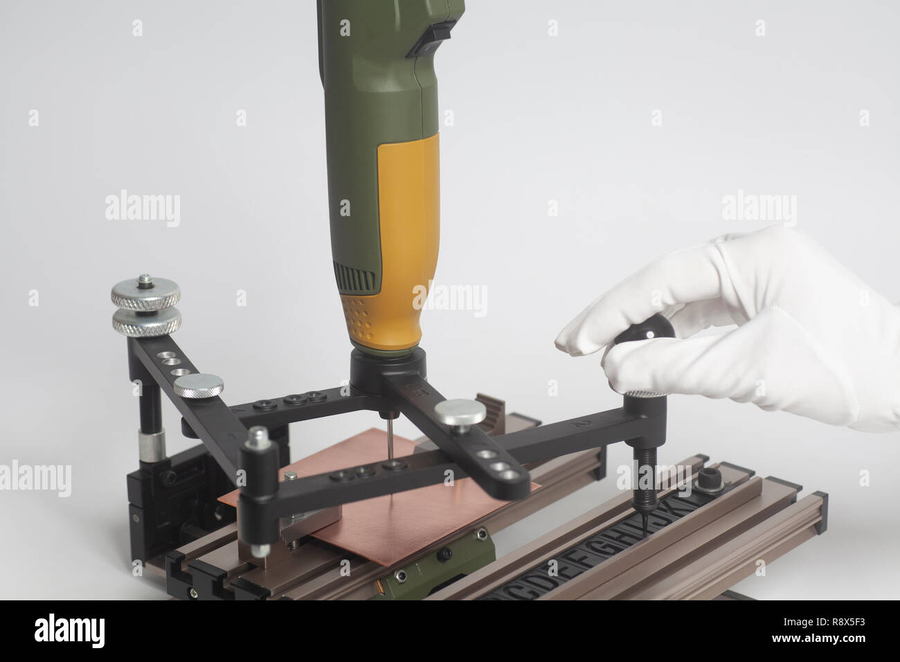 Worker hands on Engraving device pantograph with CNC engraver with ...