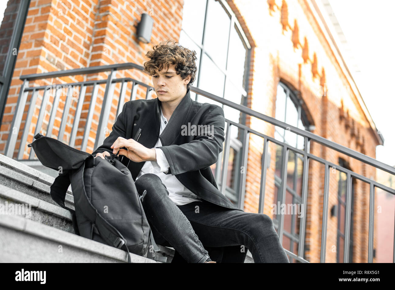 Rummaging in bag hi-res stock photography and images - Alamy