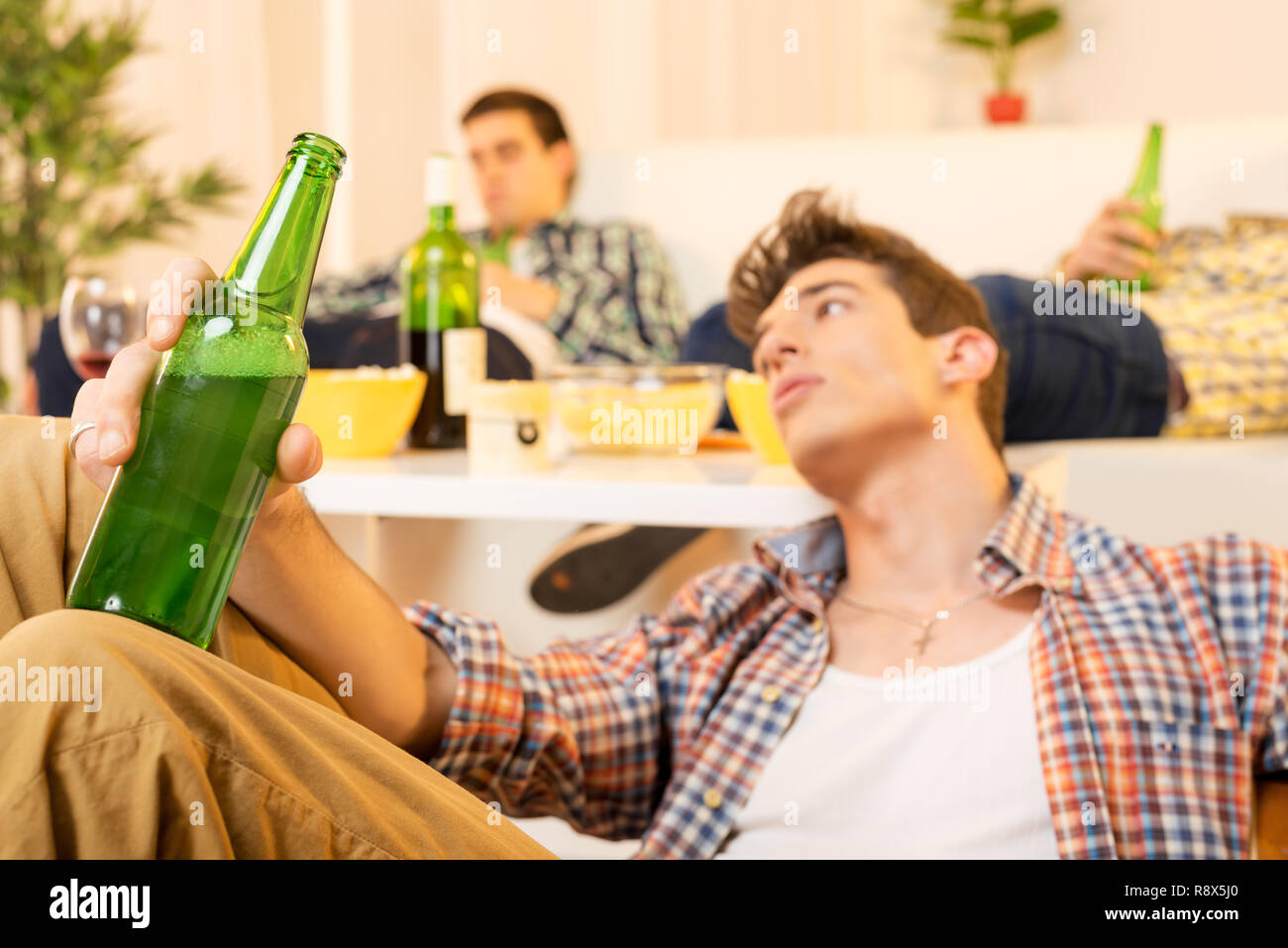 Man leaning against couch hi-res stock photography and images - Alamy