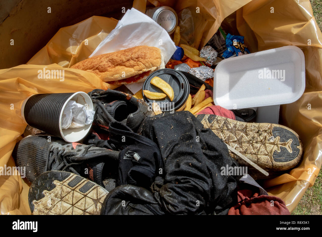 Shoes clothes paper discarded abandoned hi-res stock photography and ...
