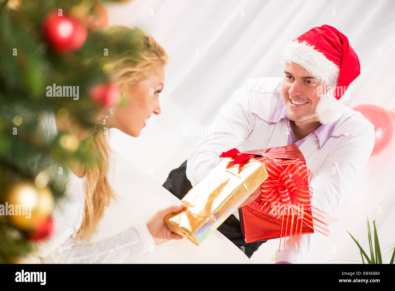 Smiling women exchanging gifts hi-res stock photography and images - Alamy