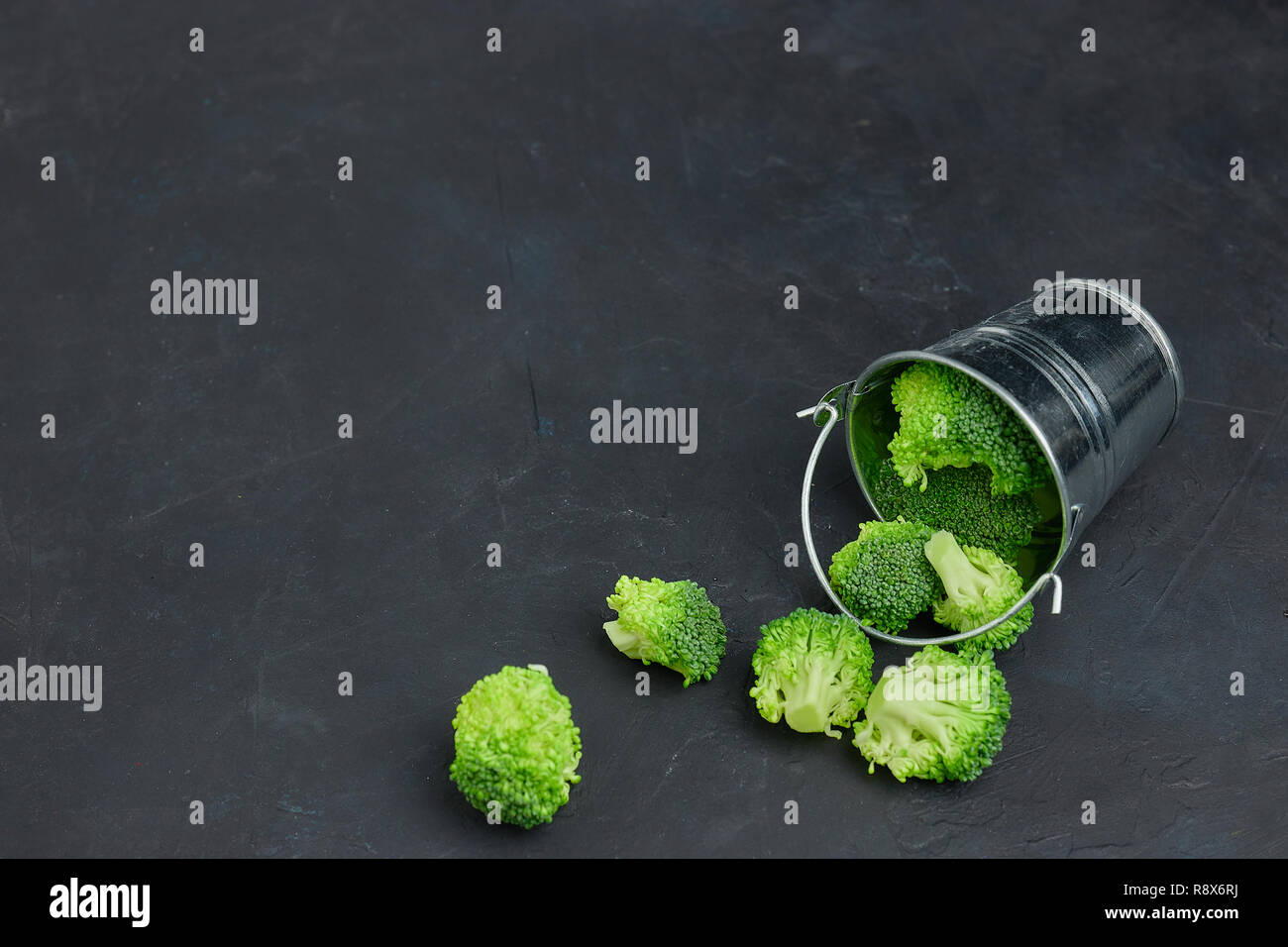 placer green broccoli segments from a small bucket. Healthy eating ...