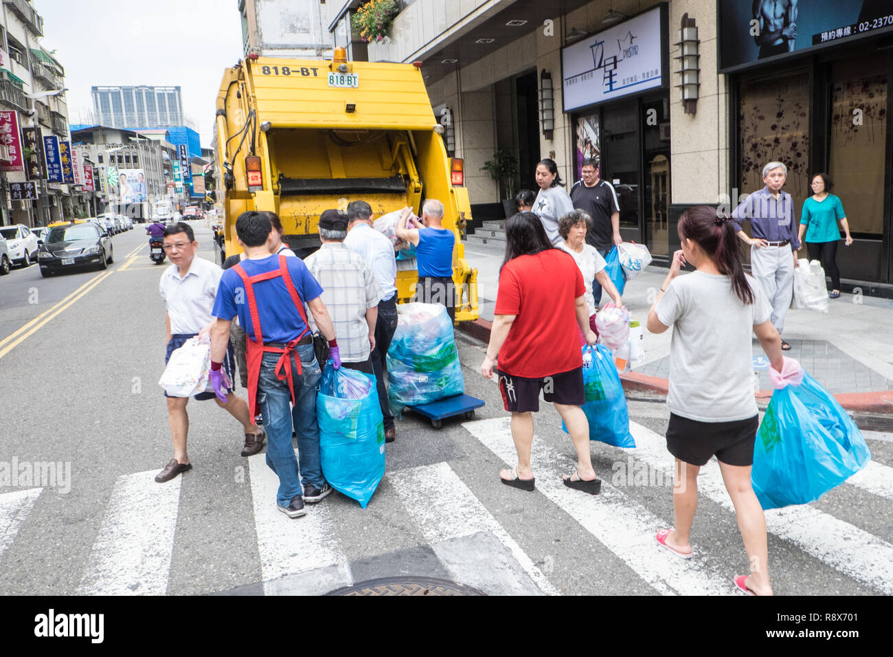 Locals,putting,waste,garbage,into,municipal,waste,collection,truck,on ...