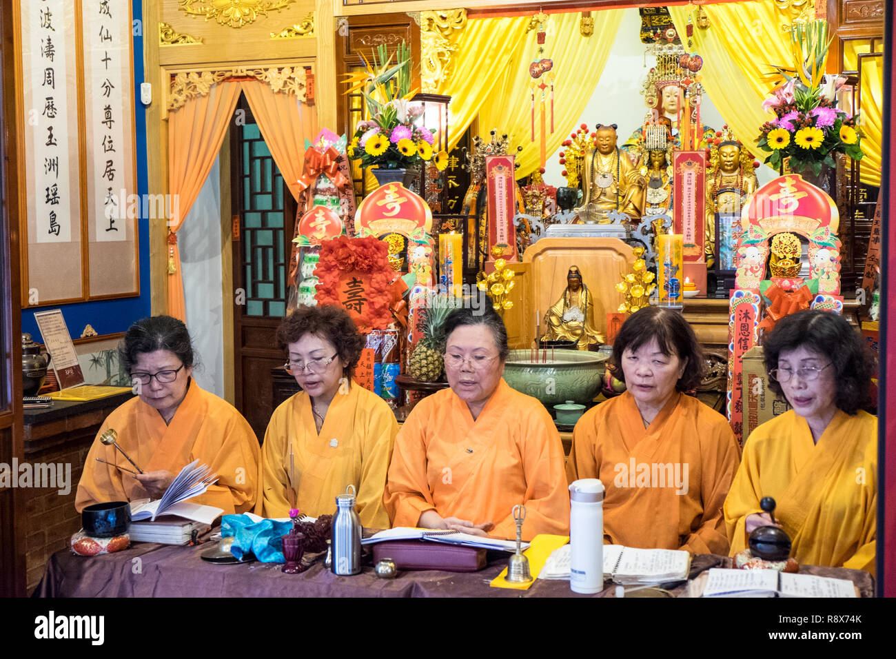 Nuns,female,chanting,sutras,at,small,temple,within,apartment,building ...