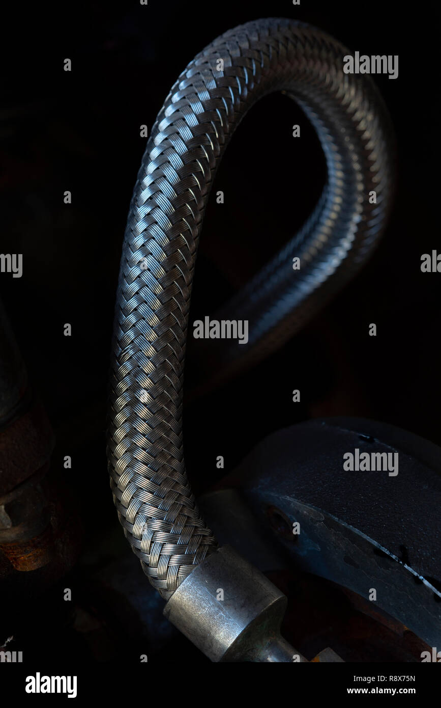 Elegant Curving Twists of Braided Engine Turbo Oil Supply Hose Stock ...