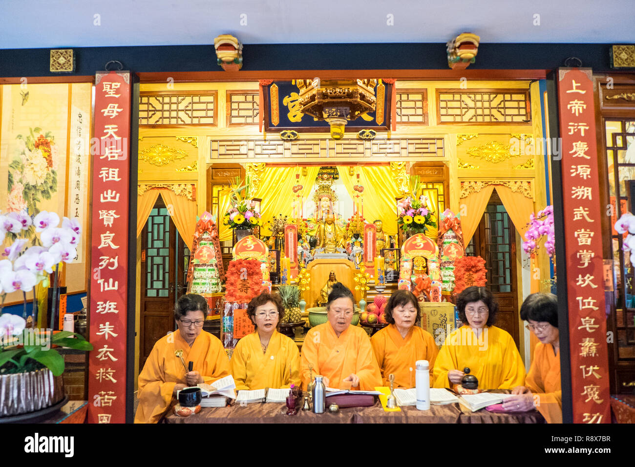 Nuns,female,chanting,sutras,at,small,temple,within,apartment,building ...